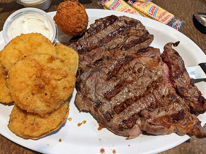 When a steak shares the spotlight with fried delights, it's like the Avengers of comfort food assembled on one heroic plate.