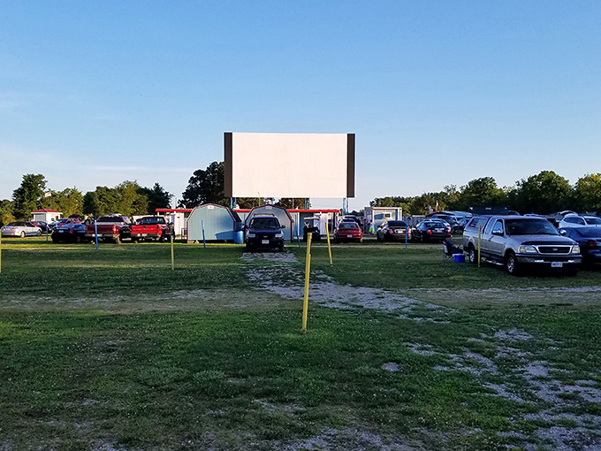 That magical moment when daylight fades and the massive screen stands ready to transport viewers to another world.