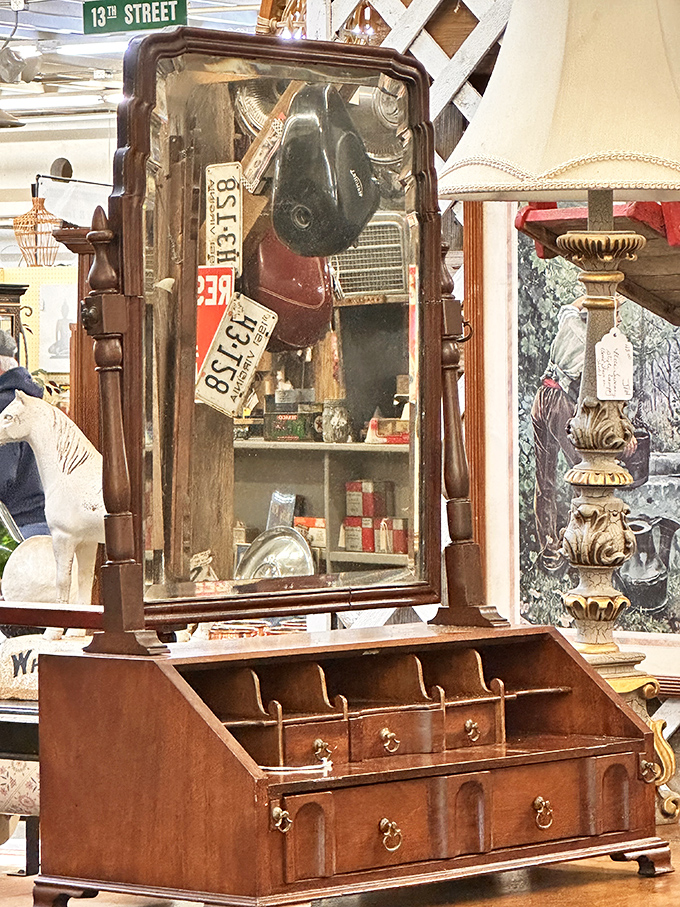 This vanity mirror has reflected a century of faces and fashions. The "13th Street" sign above reminds you there's still more mall to explore.
