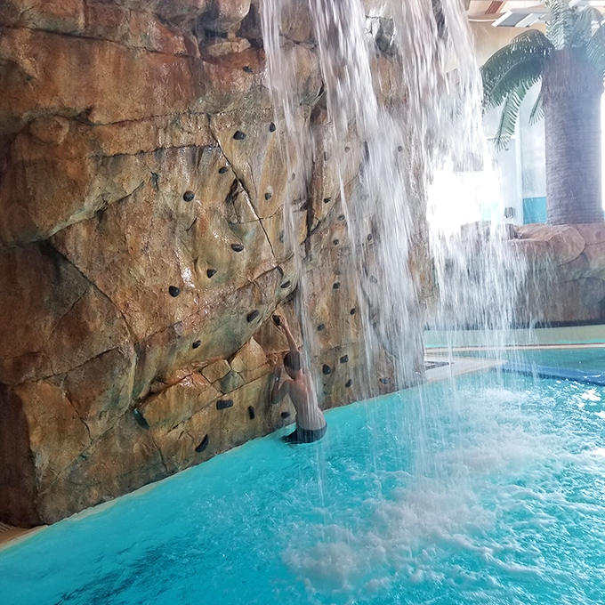 A waterfall cascading over faux rock&mdash;Mother Nature's shower head, but without the guilt of wasting water during a drought.