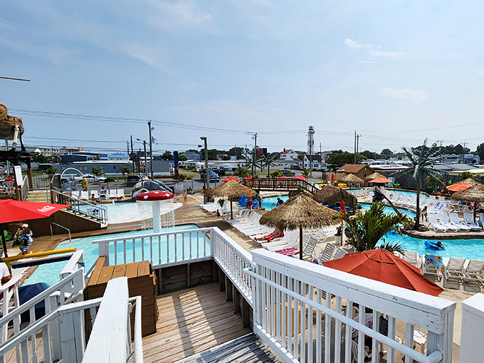 Paradise found! The water park area offers a tropical oasis where beach chairs invite relaxation between aquatic adventures.