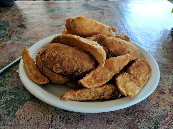 Golden-brown potato wedges that crunch like autumn leaves, offering the perfect counterpoint to Luigi's saucy Italian masterpieces.