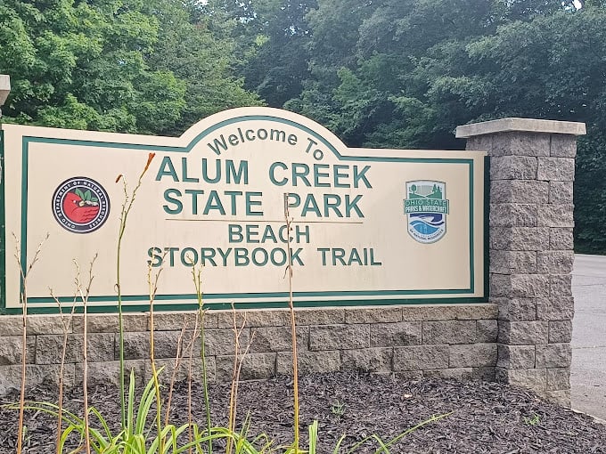 The welcome sign stands like a friendly sentinel, promising adventures that will have you forgetting about your inbox faster than you can say "out of office."