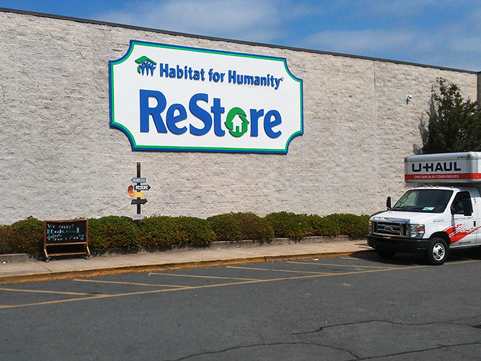 ReStore's massive sign promises big savings on home goods. Where DIY dreams meet budget-friendly reality!