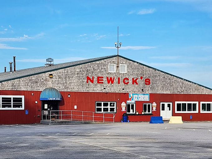 Newick's distinctive red exterior stands like a culinary lighthouse, guiding the hungry to seafood salvation.