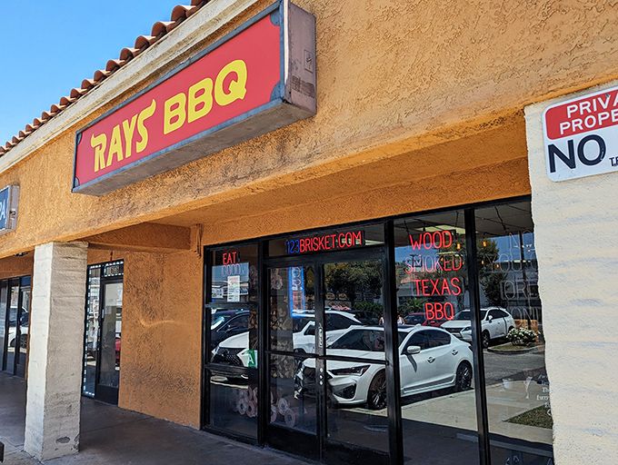 Ray's BBQ: Strip mall exterior, pitmaster paradise inside. Those neon signs in the window tell the delicious truth.
