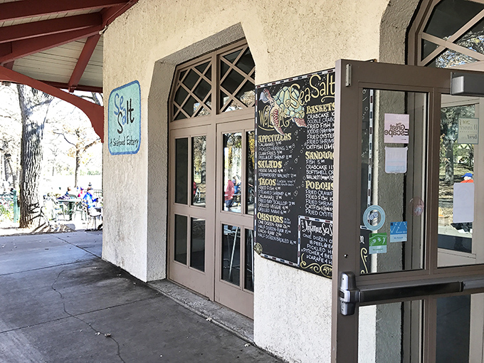 Sea Salt Eatery entrance: A humble doorway hiding seafood greatness&mdash;like finding an oyster pearl in the middle of a Minnesota park.