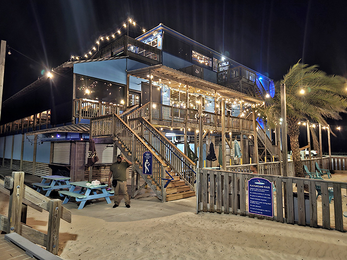 The Reef's historic building glows at night - a beacon for seafood lovers seeking both atmosphere and amazing flavors.