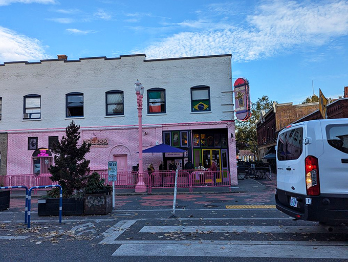 The pink-painted brick of Voodoo Doughnut stands out like a rebel in Portland's Old Town. Sweet anarchy in action!
