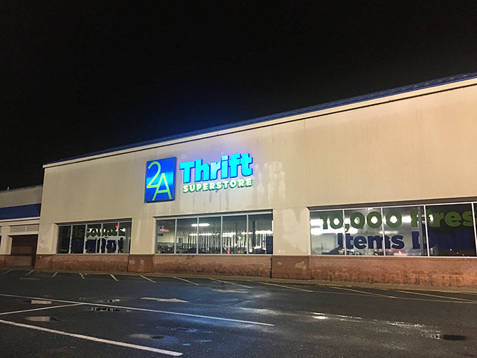 By day, a mild-mannered thrift store. By night... still a thrift store, but those blue-lit signs sure look dramatic!