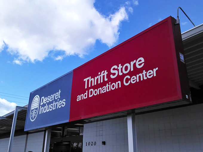 The red and blue signage of Deseret Industries pops against the desert sky. A patriotic approach to recycling fashion.