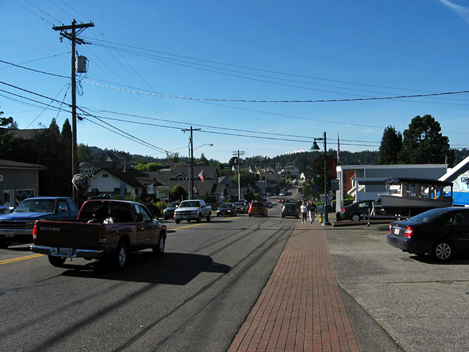 Flower baskets and American flags line Gig Harbor's streets&mdash;coastal living with small-town prices and big-hearted community.