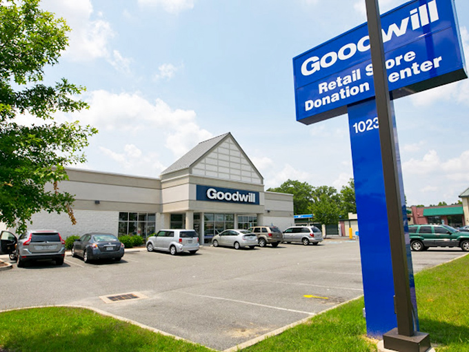 The blue Goodwill sign and donation center &ndash; where one person's "I'm done with this" becomes another's "I can't believe I found this!"