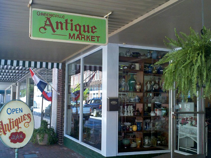 Small-town charm meets serious antiquing &ndash; this storefront window displays the kind of finds that make you cancel your afternoon plans.