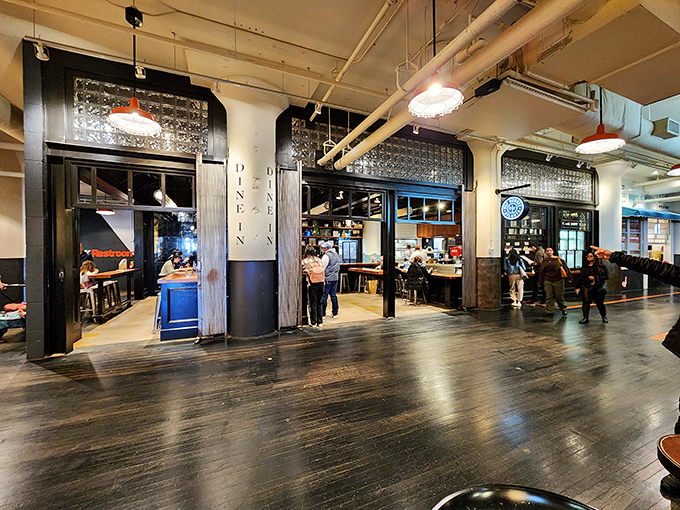 Industrial chic meets burger perfection at H&F, where open kitchens let you witness the magic before tasting it.