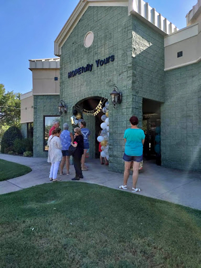 Grand opening excitement! Shoppers gather outside HOPEfully Yours, drawn by the promise of upscale finds at down-to-earth prices.