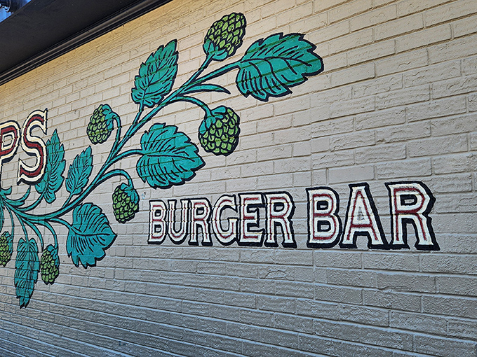 That gorgeous hop vine mural tells you everything: these folks take their burgers as seriously as their brews.