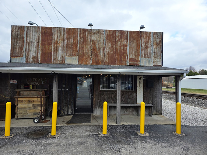 Those yellow safety poles aren't protecting the building - they're protecting you from rushing in too quickly!