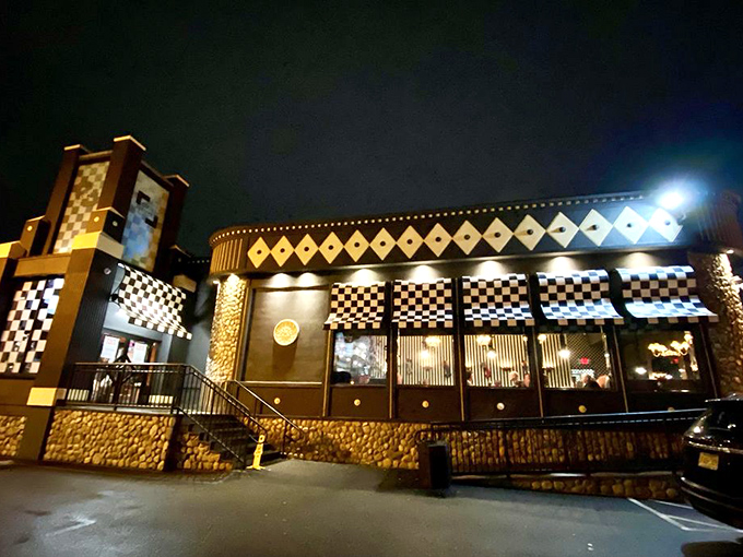 Chit Chat Diner lit up at night: Gotham City meets breakfast club! This architectural showstopper glows with the promise of midnight waffles.