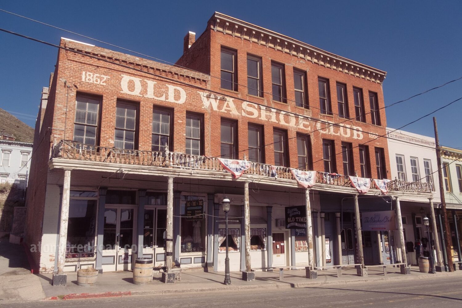 The historic buildings of Virginia City cling to the mountainside, their brick facades and wooden balconies telling tales of silver boom days.