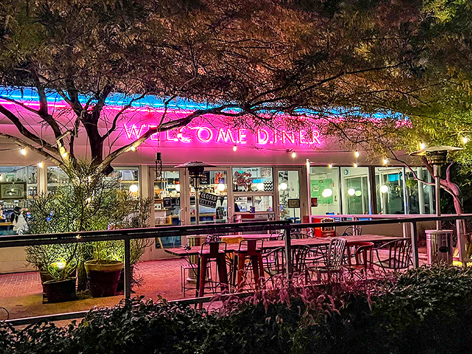 By night, Welcome Diner transforms into a glowing beacon of comfort food. Those pink lights promise Southern classics with an Arizona twist.