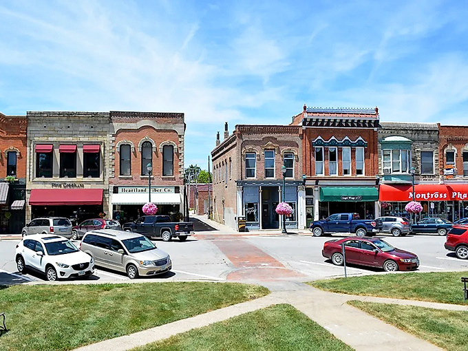 Autumn transforms Winterset's main street into a painter's palette of warm colors against red brick and blue sky.