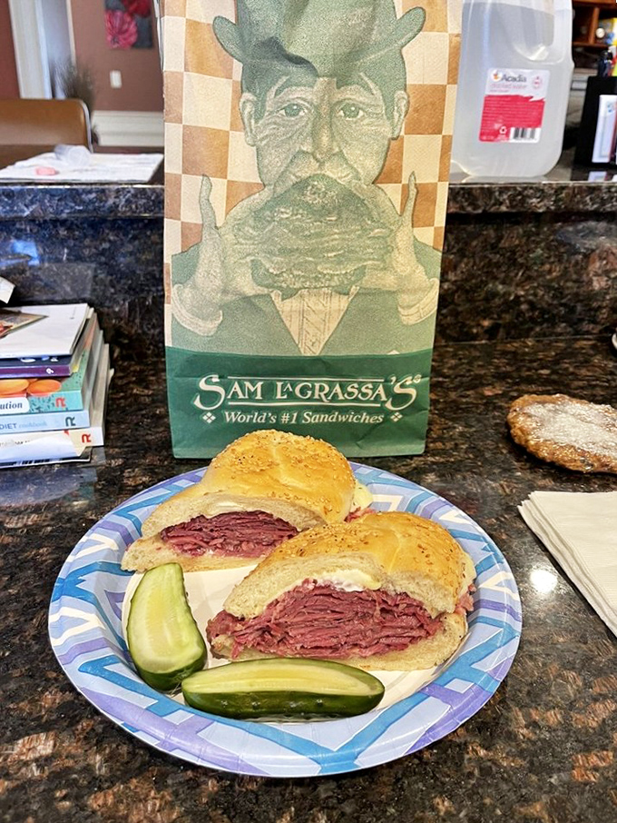 The cross-section reveals the truth: perfectly stacked corned beef with just the right ratio of sauerkraut and cheese. 