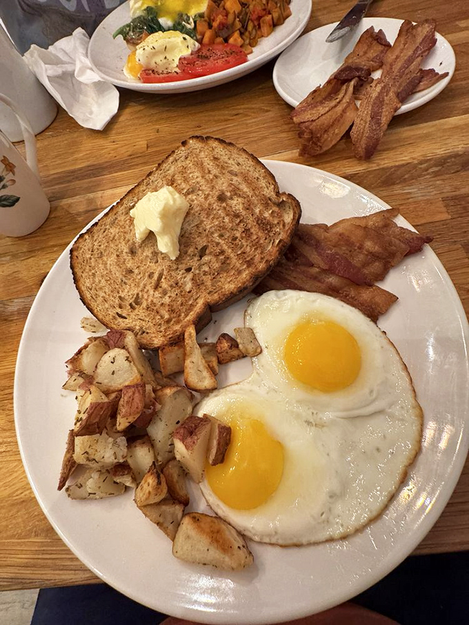 The All-American breakfast plate&mdash;where eggs, toast, bacon, and potatoes gather for a morning summit on how to start your day right.