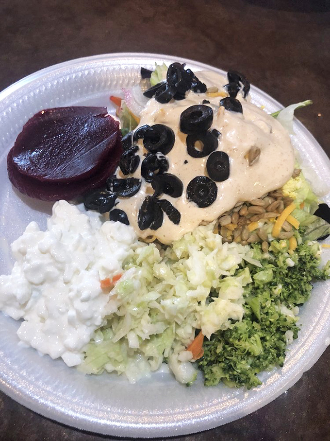 A salad that's actually worth eating at a seafood joint. Those black olives aren't just garnish&mdash;they're little flavor bombs waiting to explode.