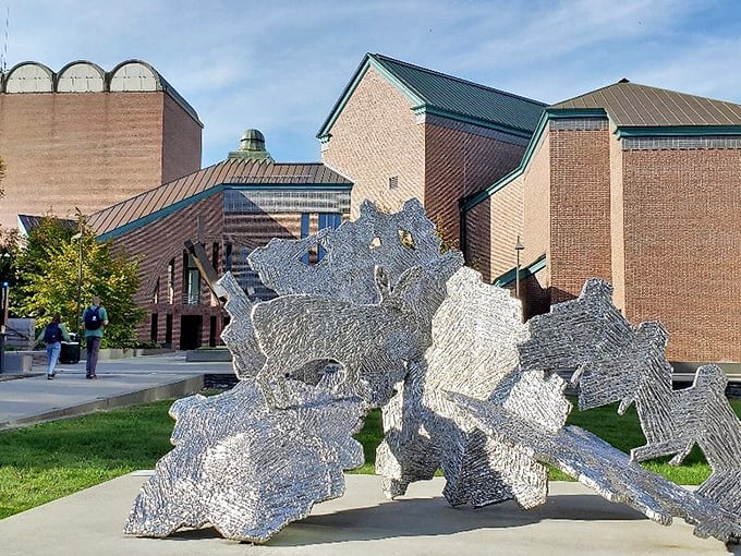 Modern sculpture creates conversation on campus grounds. This metallic installation proves that art doesn't have to match the drapes to make a powerful statement.