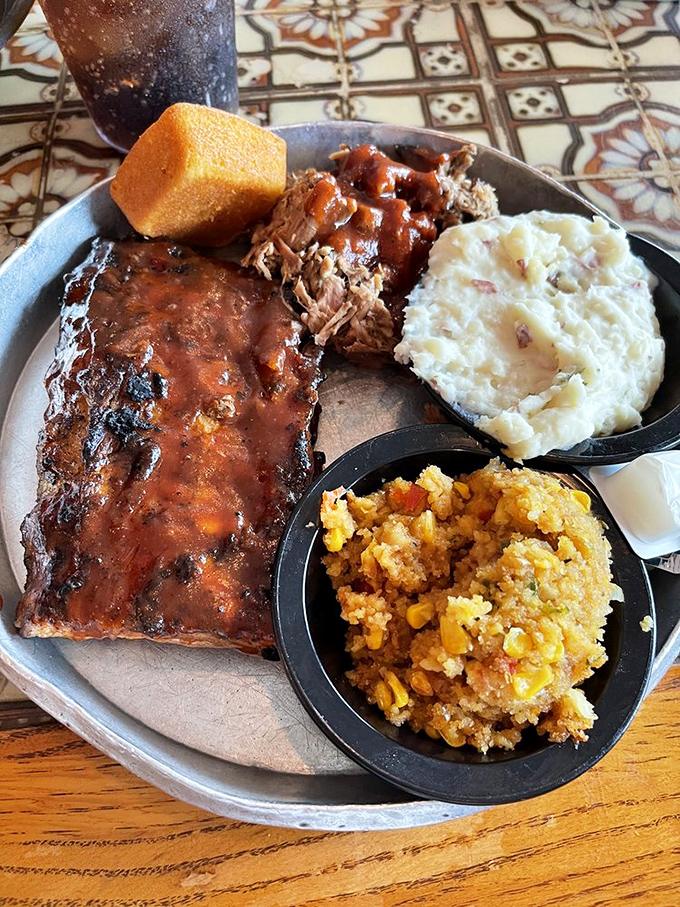 A platter that answers the eternal question: "Why choose one meat when you can have three?" Side dishes playing their A-game.