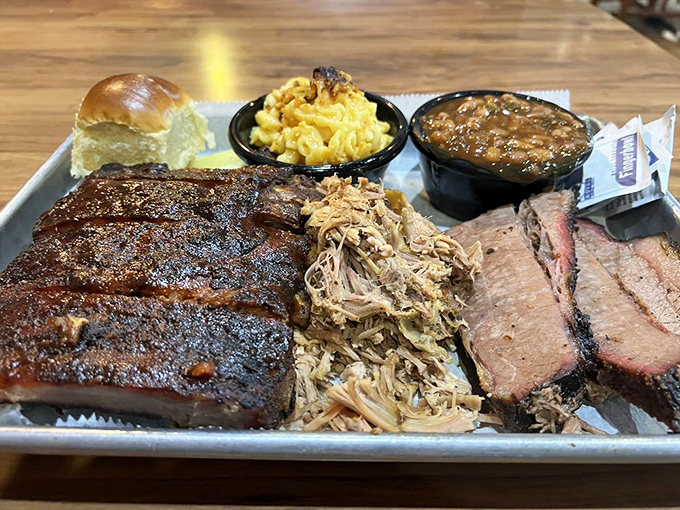 A metal tray that holds more culinary history than most five-star restaurants. The bark on those ribs is the result of patience&mdash;something we could all use more of.
