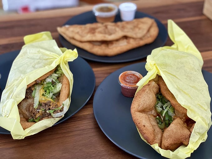 Two tacos are better than one! Yellow paper wraps these treasures like culinary gifts, with salsa on standby for that perfect flavor boost.