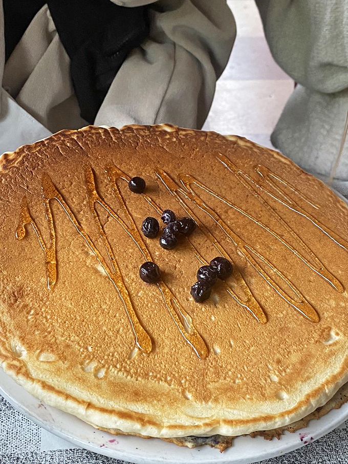 This pancake isn't just large&mdash;it's the breakfast equivalent of the moon landing, one giant leap for mankind's morning appetite.