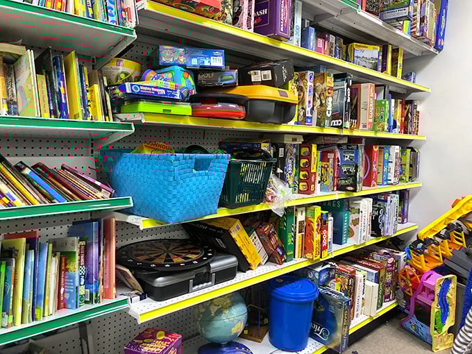 Board games and toys stacked like a childhood memory bank. Someone else's abandoned Monopoly game is your family's next game night waiting to happen.