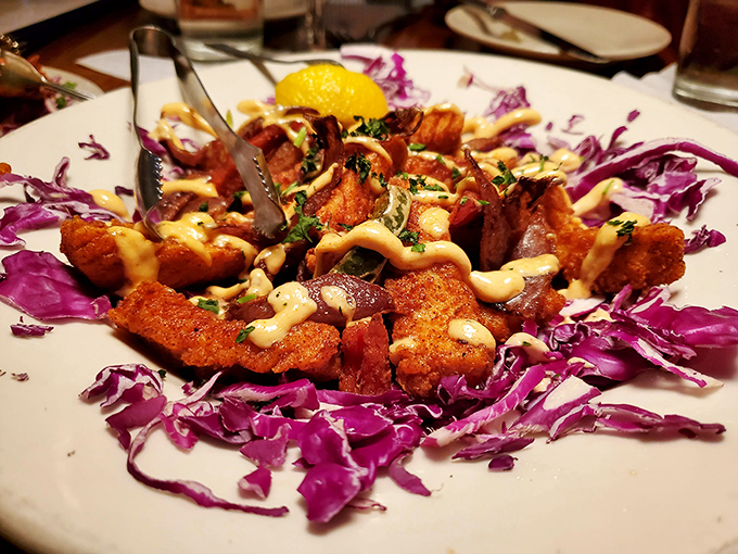 Calamari that would make an Italian grandmother nod with approval, nestled on a bed of purple cabbage like ocean treasures.