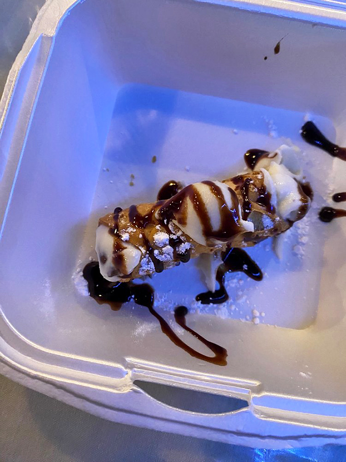This cannoli isn't just dessert&mdash;it's a sweet little lifeboat sailing across a sea of chocolate drizzle, rescuing you from the ordinary.