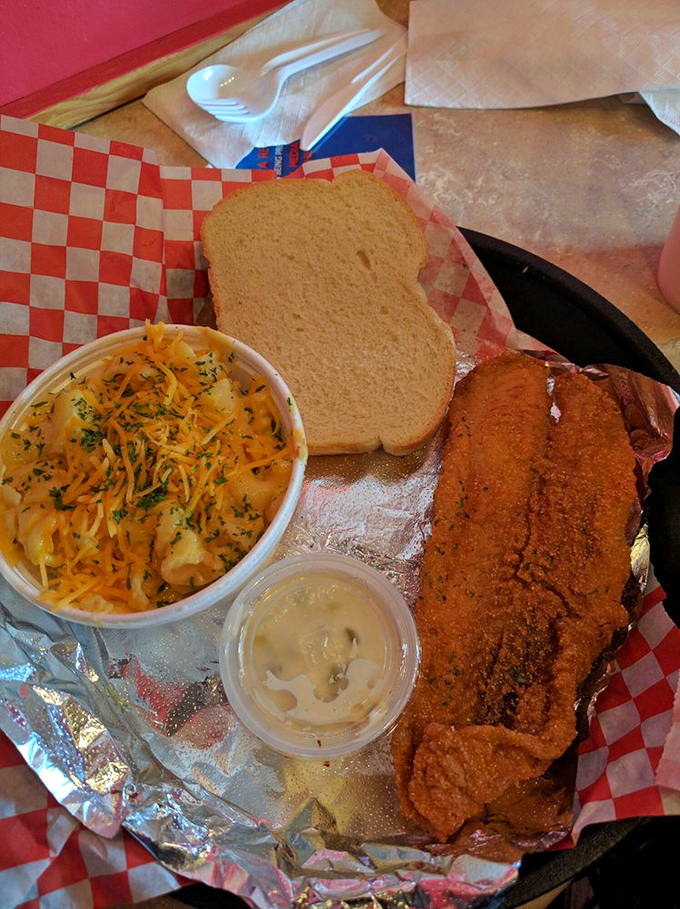 Crispy catfish meets cheesy comfort in a plate that bridges Southern traditions. Grandma would approve of this matchmaking.