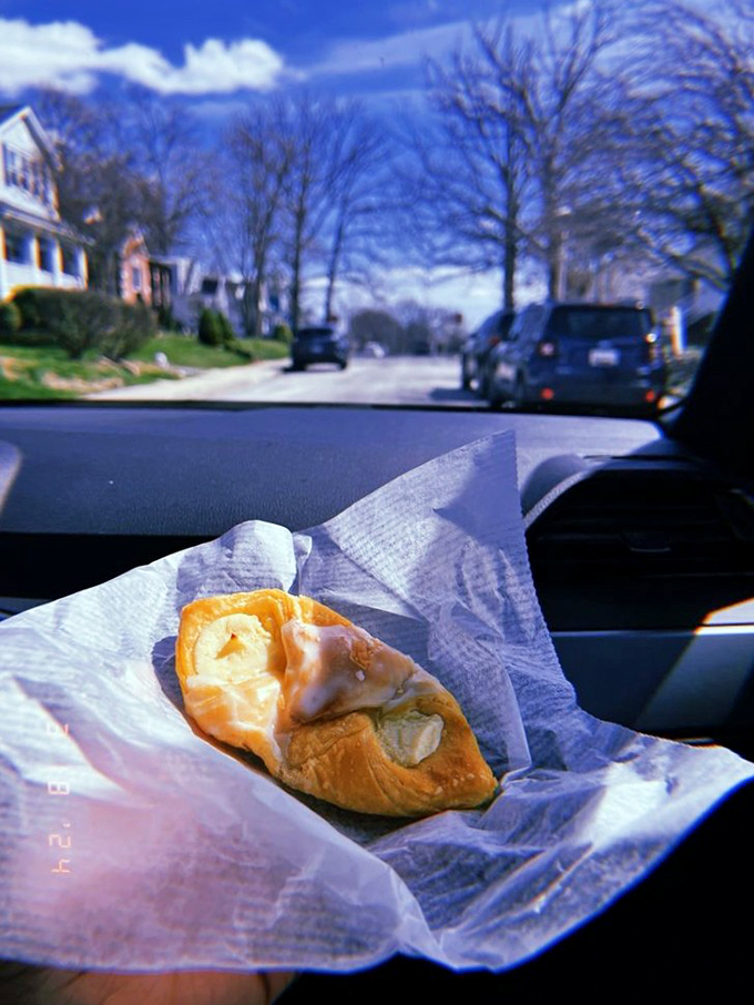 The ultimate car dashboard dining experience – a Fenwick pastry enjoyed with a view of suburban Baltimore. Life's simple pleasures.