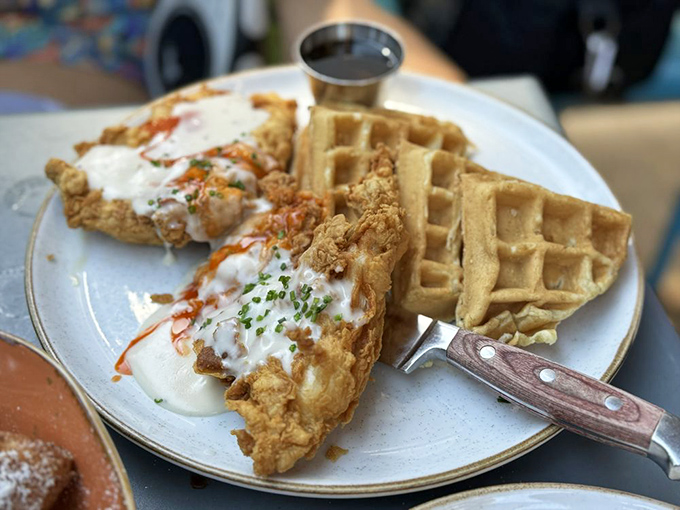 Chicken and waffles: the breakfast equivalent of a power couple. That drizzle of sauce is like the perfect accessory that ties the whole outfit together.