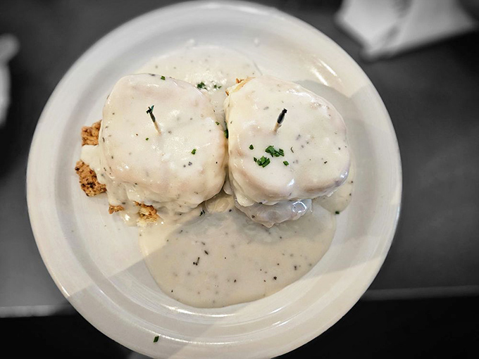 Biscuits smothered in black pepper gravy&mdash;Southern comfort on a plate. Like a warm hug from your favorite aunt, if your aunt was a culinary genius.