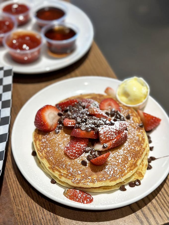 The interior's wooden tables and green accents create an atmosphere that says "we take breakfast seriously, but not ourselves."