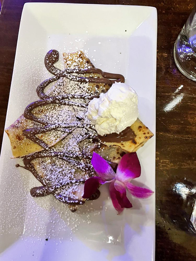 This chocolate cr&ecirc;pe doesn't just satisfy a sweet tooth&mdash;it launches a full-scale charm offensive with whipped cream and artful presentation.