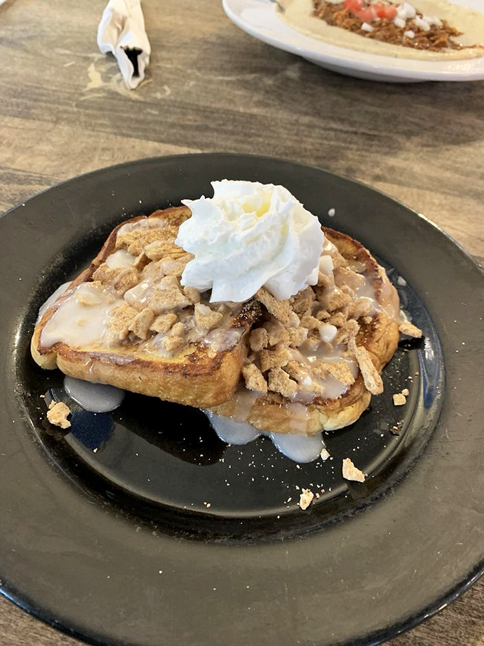 Cinnamon crunch French toast topped with whipped cream&mdash;proof that sometimes the best adult decisions look suspiciously like childhood dreams.