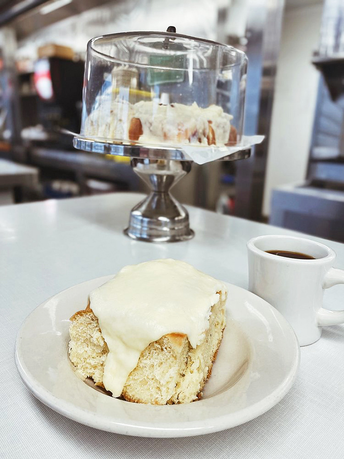 The cinnamon roll that launched a thousand road trips. That cream cheese frosting practically demands you lick the plate when nobody's looking.