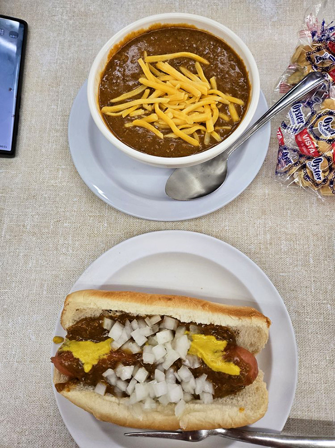 The ultimate Detroit power couple: a perfectly dressed Coney dog alongside a bowl of their legendary chili. Some duos were just meant to be.