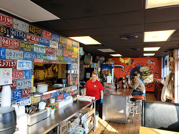 The entrance welcomes you with industrial charm and license plate panache. Step in hungry, waddle out happy. 