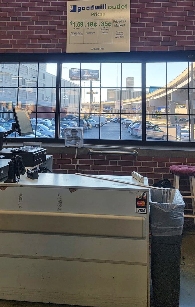 The checkout counter, where dreams are weighed and priced &ndash; the pricing board reveals the magnificent truth that clothing costs less than a coffee.