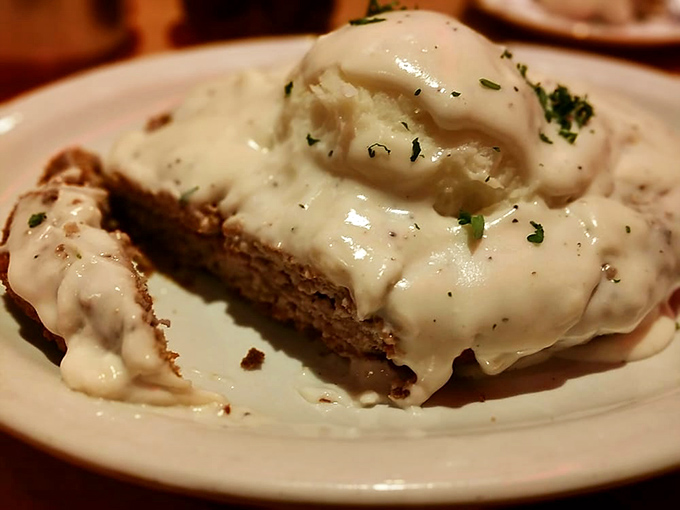 Country fried steak swimming in creamy gravy—comfort food that hugs your insides while whispering, "Diet tomorrow, friend. Tonight, we celebrate."