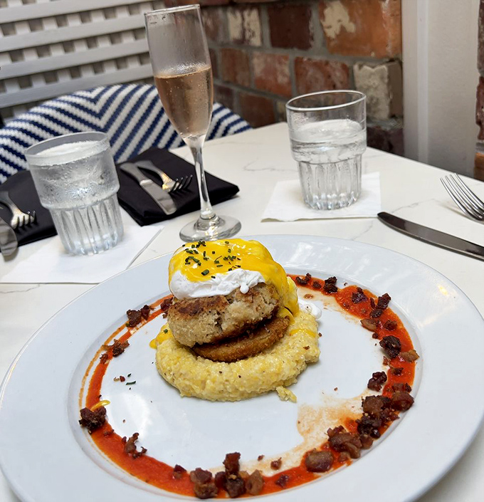 Brunch perfection exists, and it involves crab cakes, poached eggs, and hollandaise. The crispy bacon bits around the edge? That's Charleston showing off.